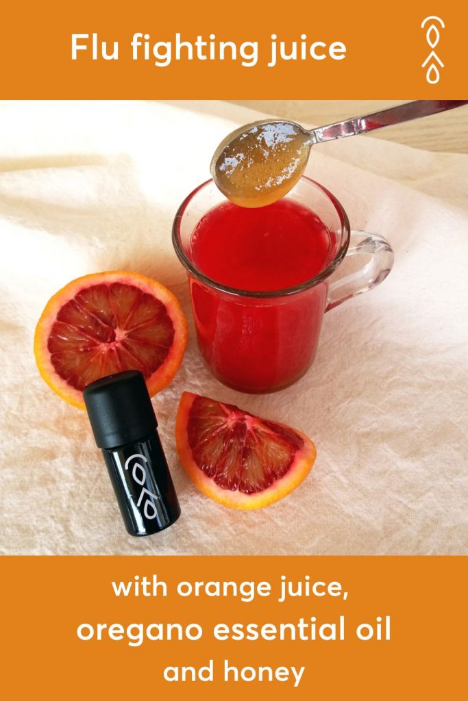 Flu fighting juice with orange juice, oregano essential oil and honey ...